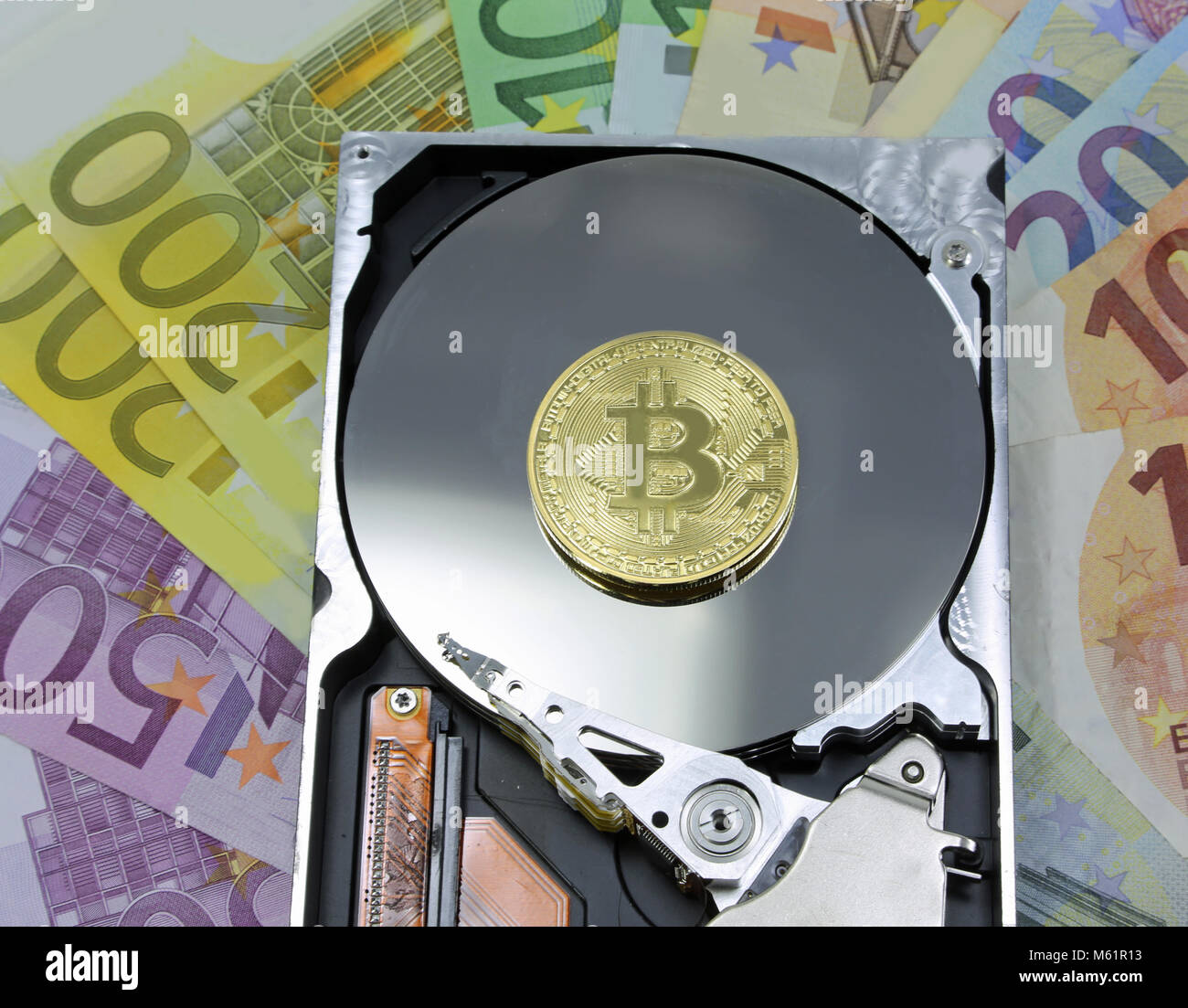 hard disk with golden bitcoin and background european currency Stock ...