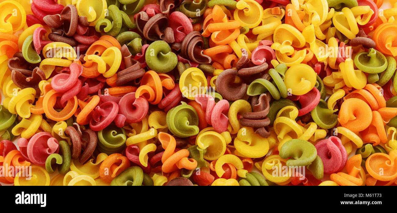 Dry italian pasta in five colours. Background Stock Photo - Alamy