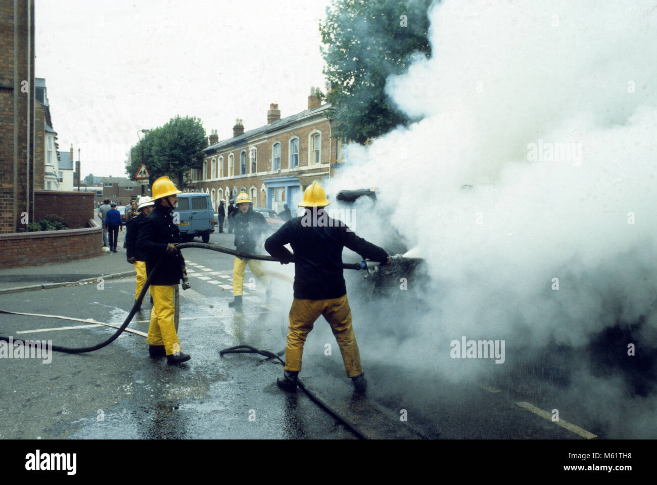 Firemen controlling burning cars during 1985 Handsworth riots in ...