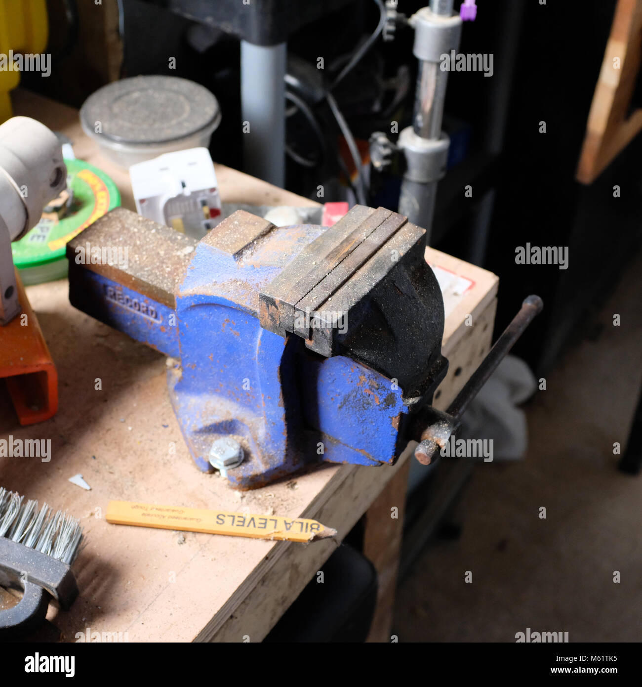 workshop vice attached to a wooden table Stock Photo - Alamy