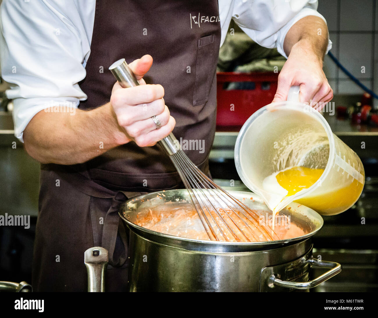 German Michelin star chef Michael Kempf preparing the blood orange ...