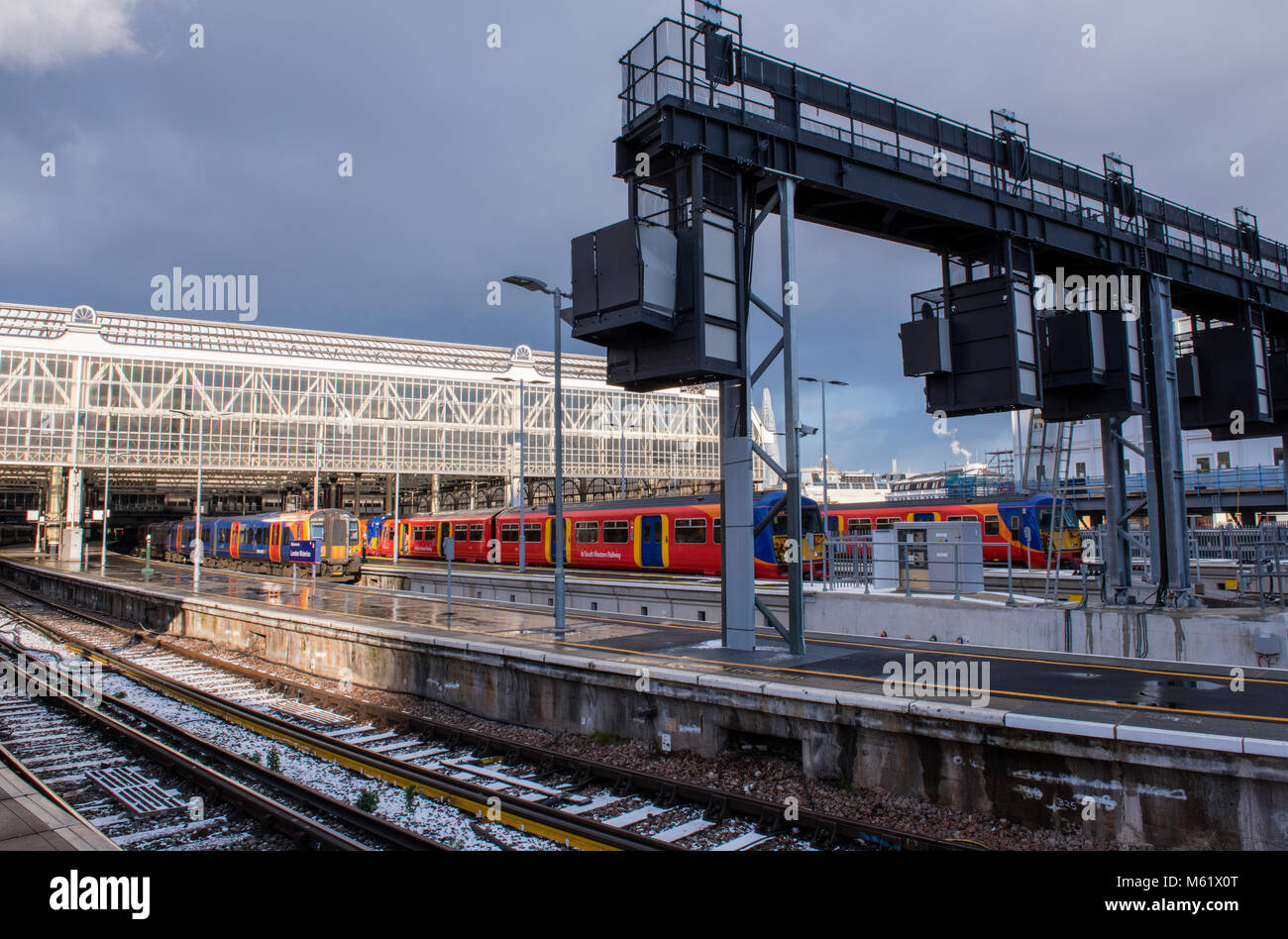 Trains in platforms at London Waterloo station on a cold and moody ...