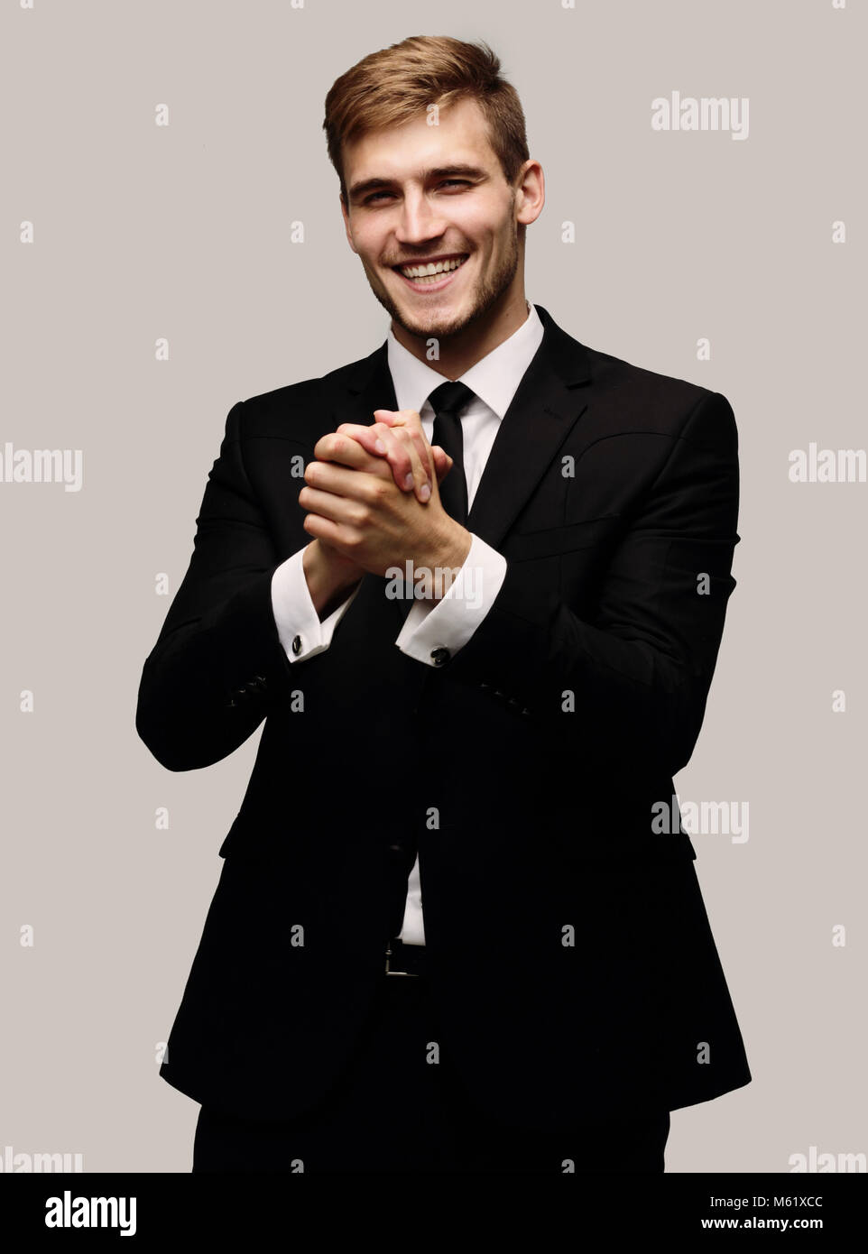 successful businessman making a welcoming gesture Stock Photo - Alamy