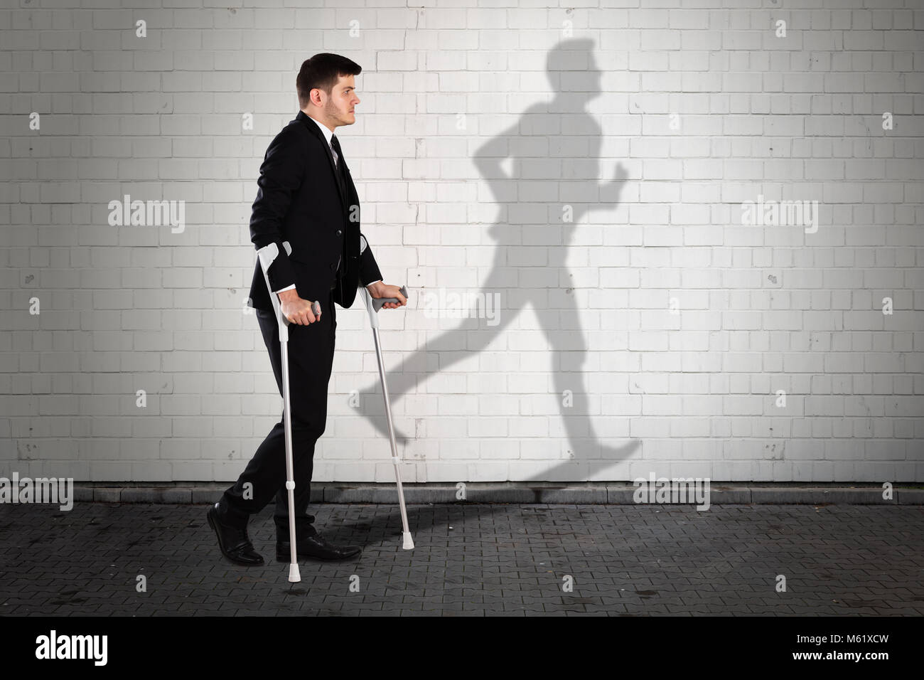 Shadow Of Man Running Formed On Wall With Young Businessman Walking ...