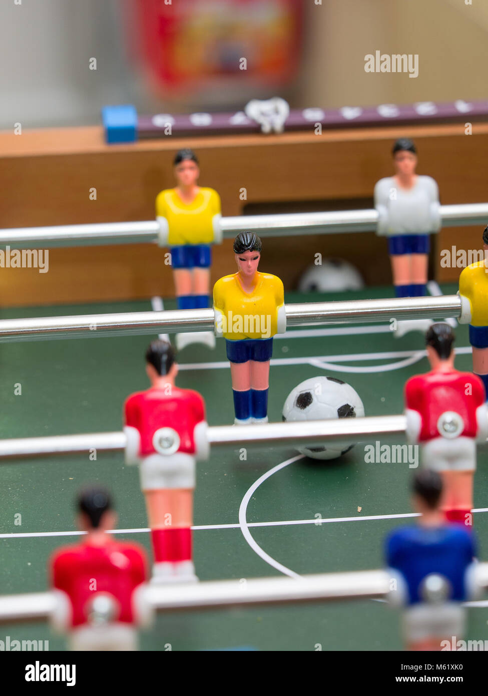 table football detail of colorful players (figurines), one of them and ...