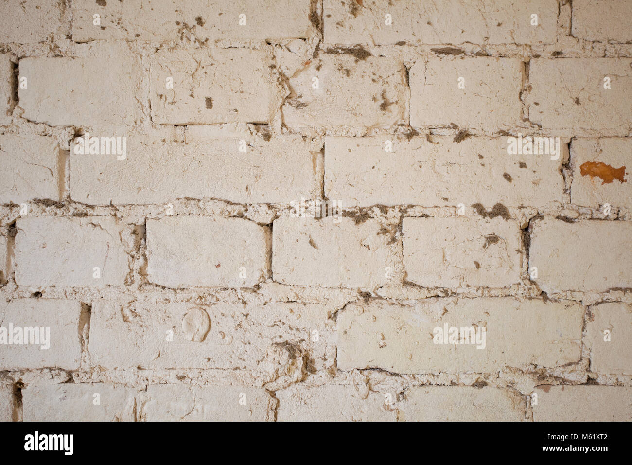 old wire cut bricks painted white. Close up Stock Photo - Alamy