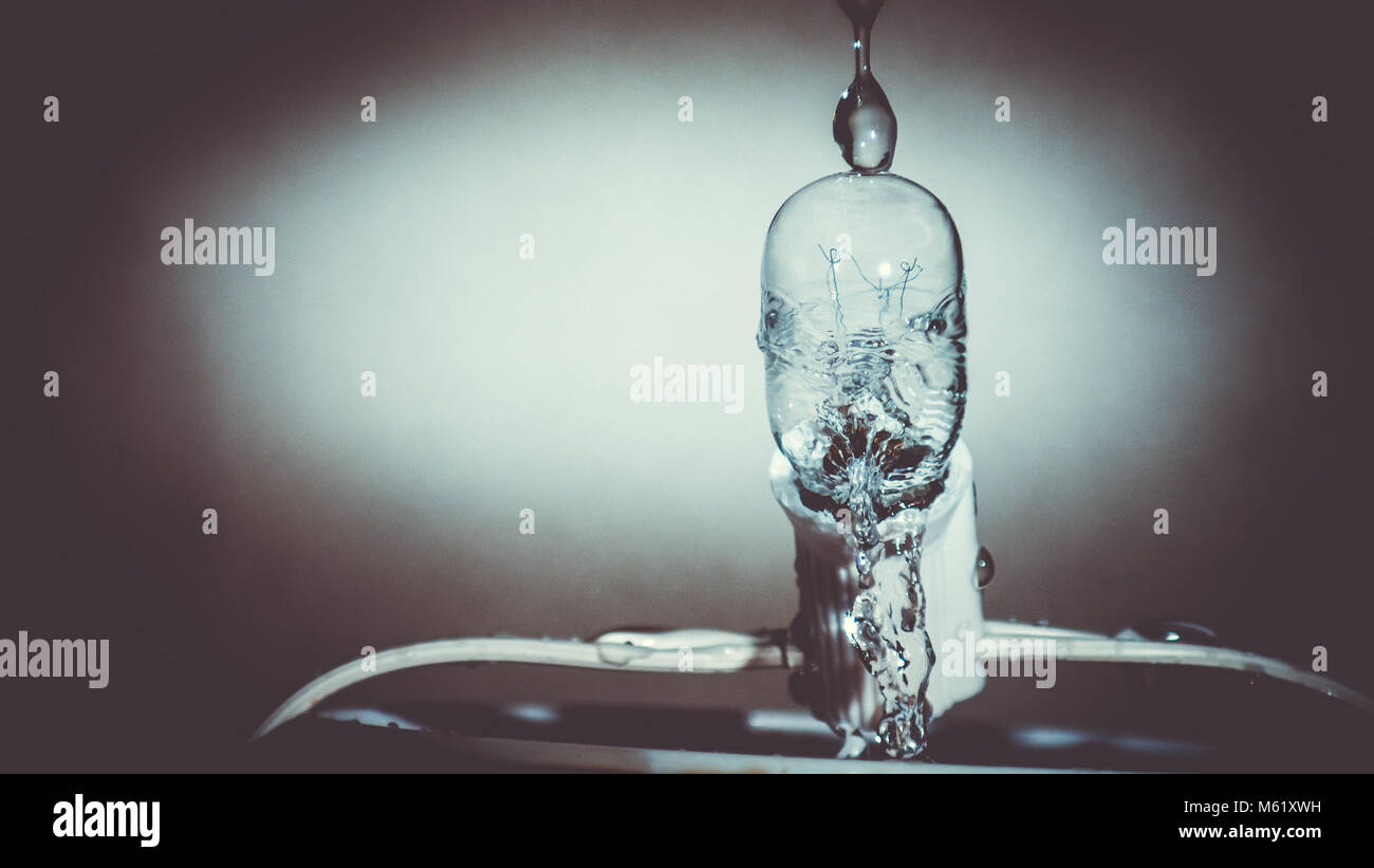 Water Dripping onto a Lightbulb Stock Photo - Alamy
