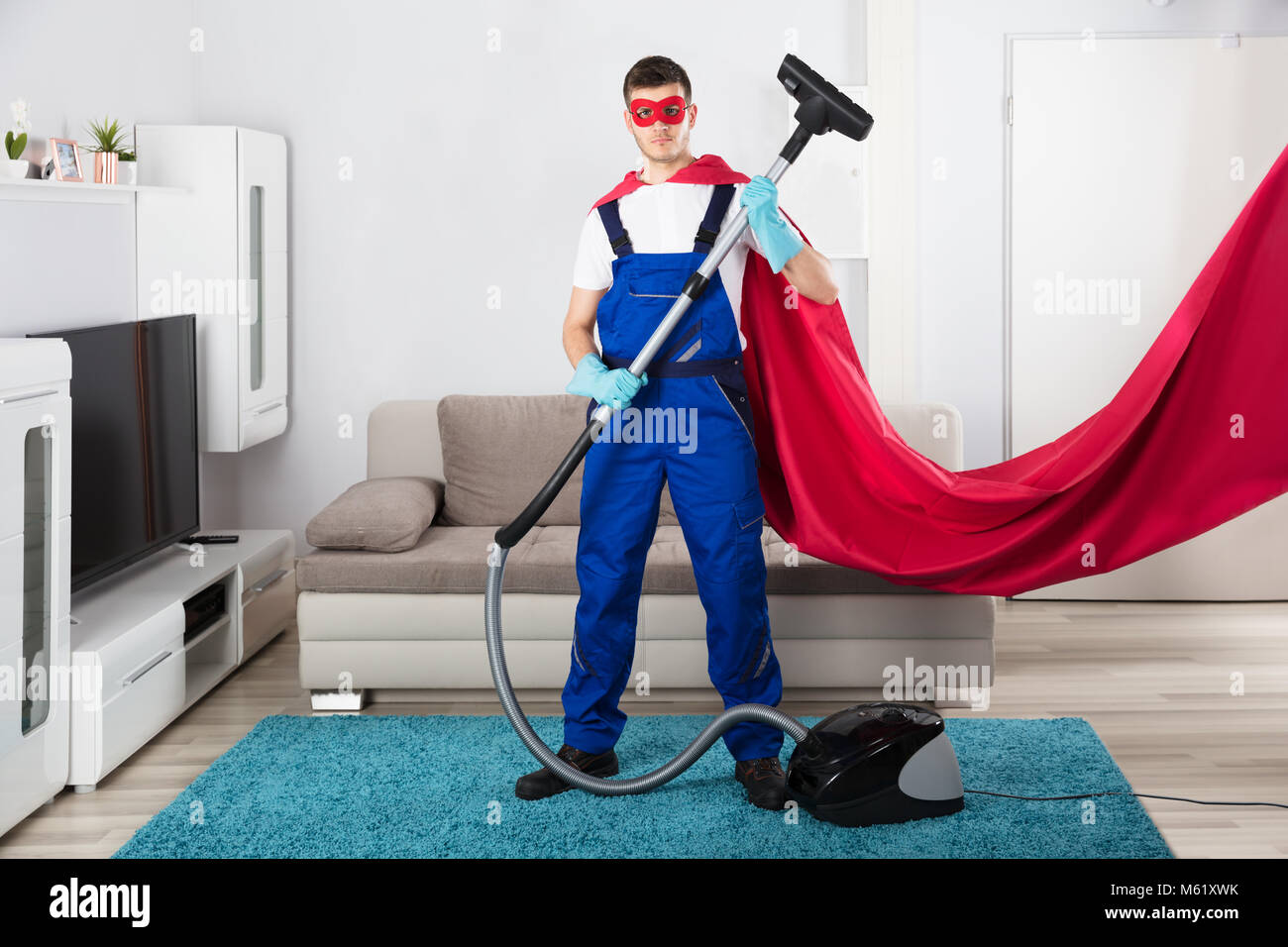 Superhero Janitor Cleaning Carpet With Vacuum Cleaner In Living Room ...