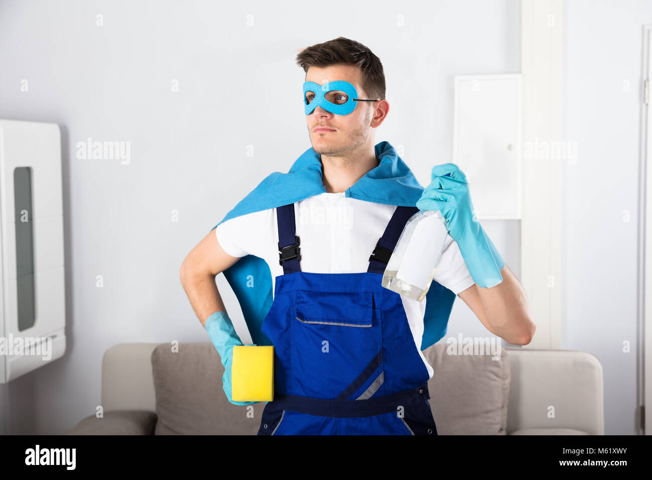 Young Superhero Janitor In Blue Cape Holding Cleaning Equipments Stock ...