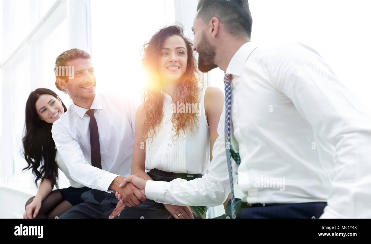 welcome handshake between two colleagues Stock Photo - Alamy