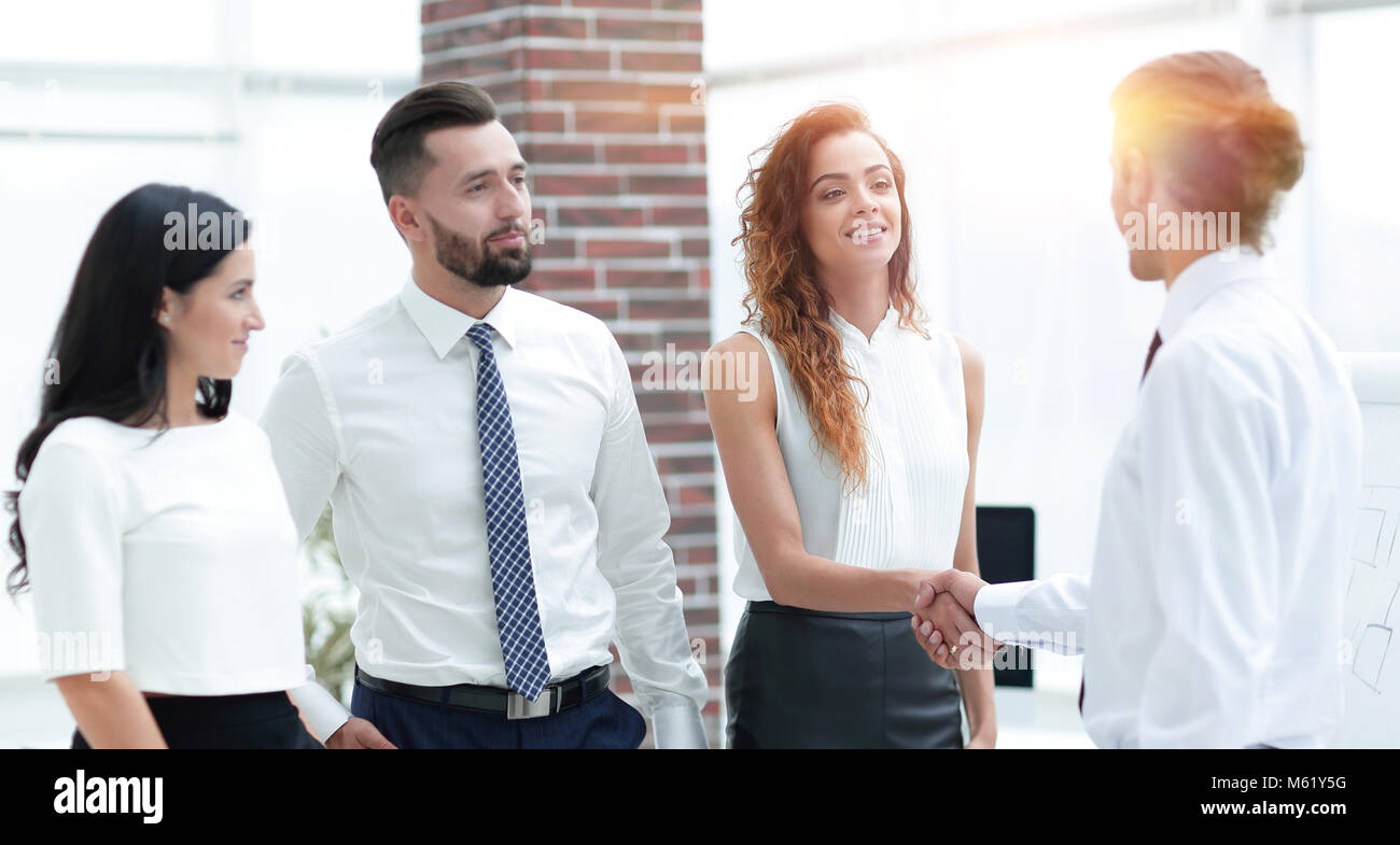 handshake business partners in the office Stock Photo - Alamy