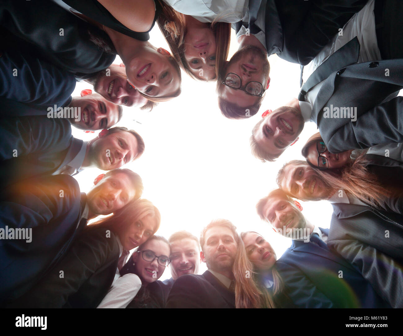 large business team is forming a circle and looking at the camera Stock ...