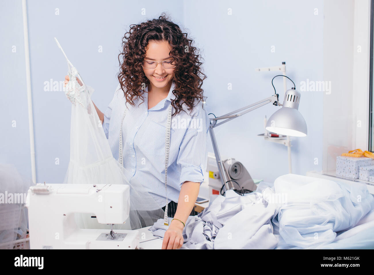 dressmaker tailoring to order. professional tailor.mastering of sewing ...
