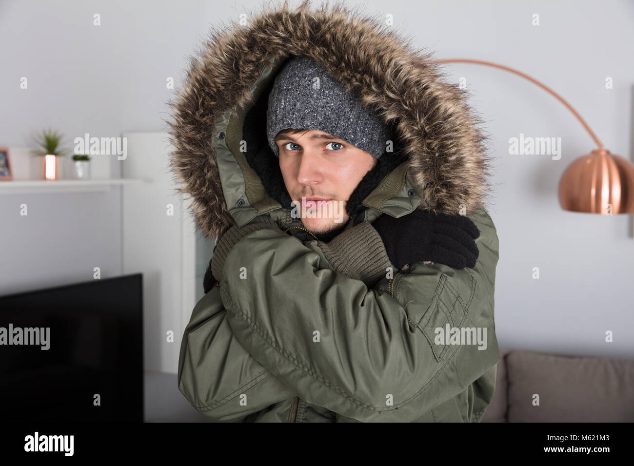 Person cold inside house hi-res stock photography and images - Alamy