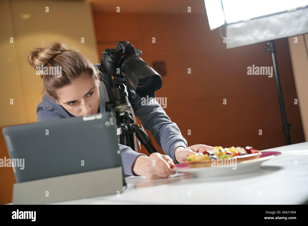 Young woman in photography training class Stock Photo - Alamy
