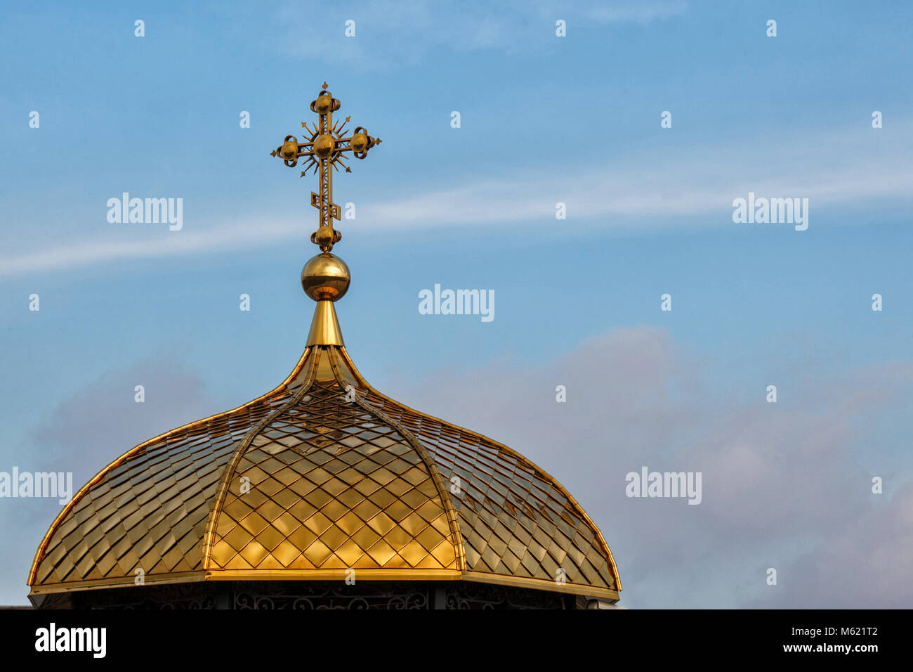 Gilded dome of orthodox Christian church shines on the blue sky ...