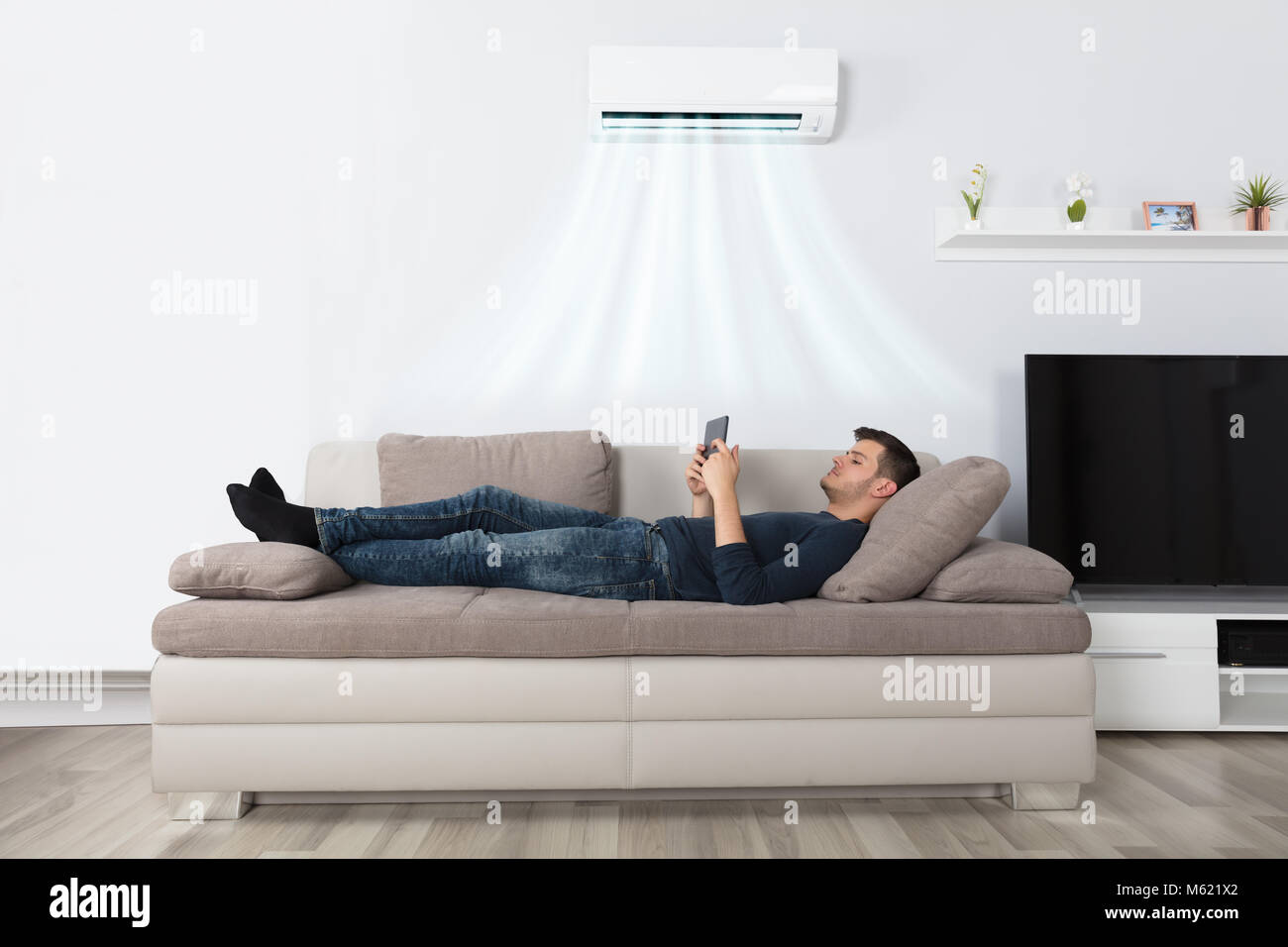 Handsome man air conditioner hi-res stock photography and images - Alamy