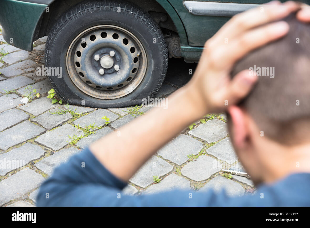 Car punctured hi-res stock photography and images - Alamy