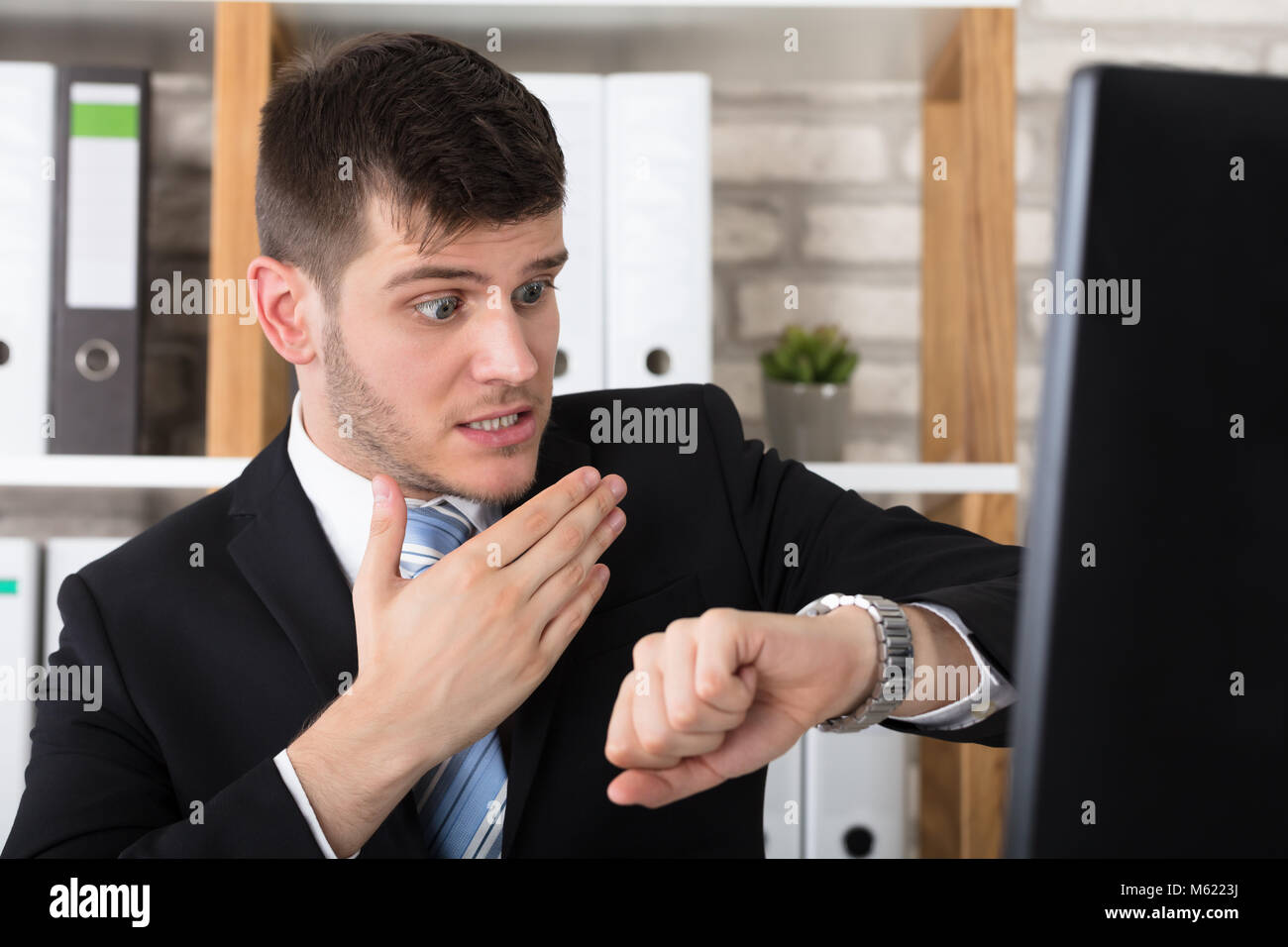 Checking the time watch hi-res stock photography and images - Alamy
