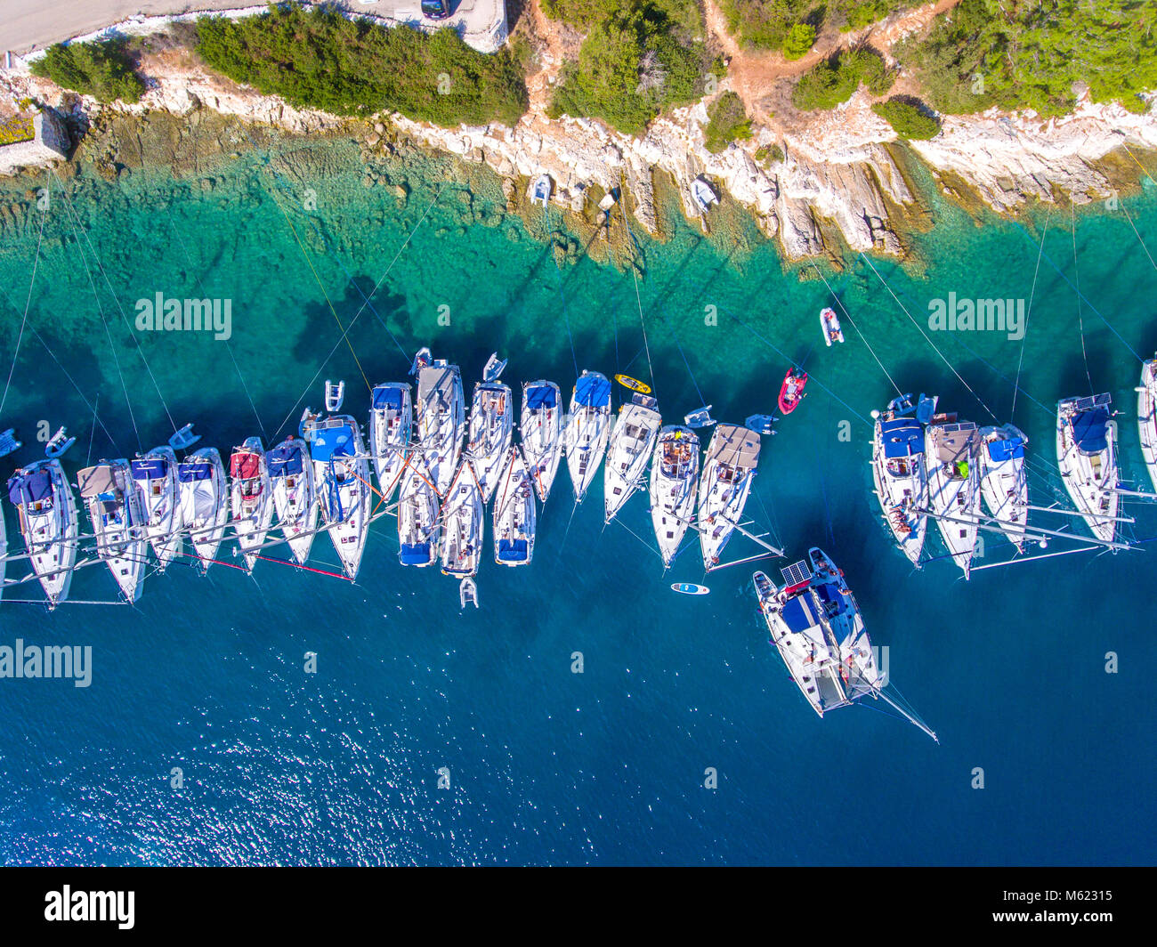 Yachts ancored in a bay with clear blue waters aerial view Stock Photo ...