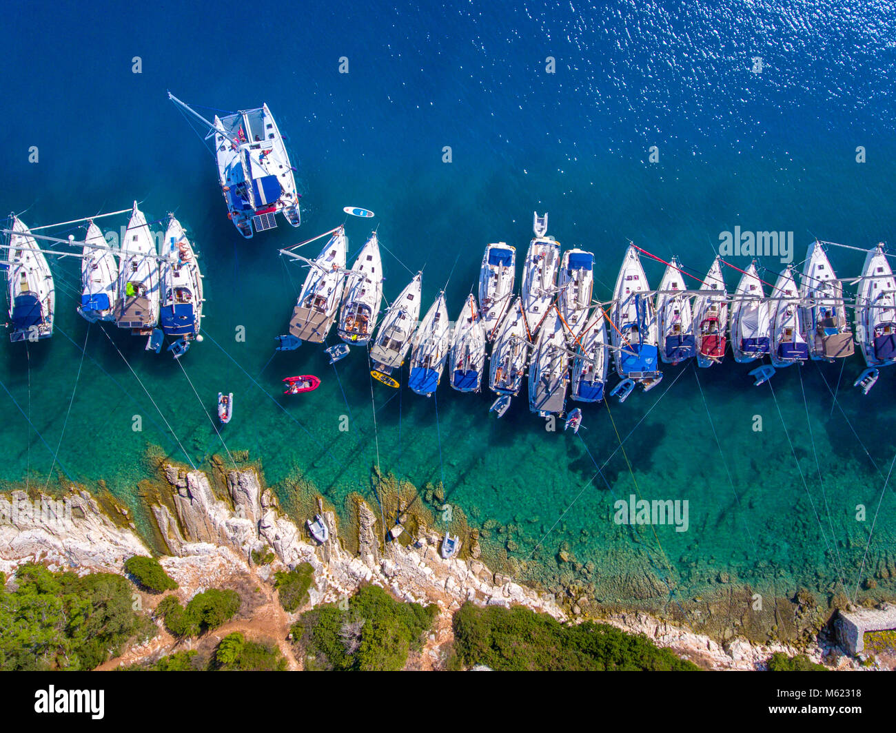 Yachts ancored in a bay with clear blue waters aerial view Stock Photo ...