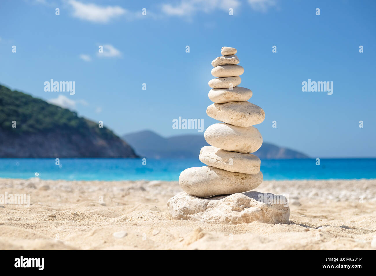Balancing several of stones on the seashore beach Stock Photo - Alamy