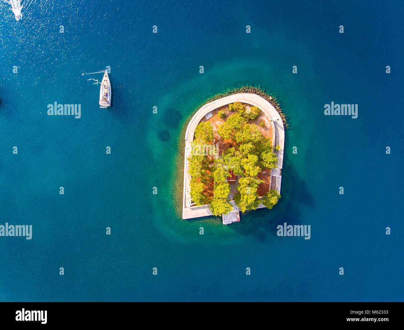 Vathy Ithaca (Ithaka) harbour entrance with famous small Church Stock ...