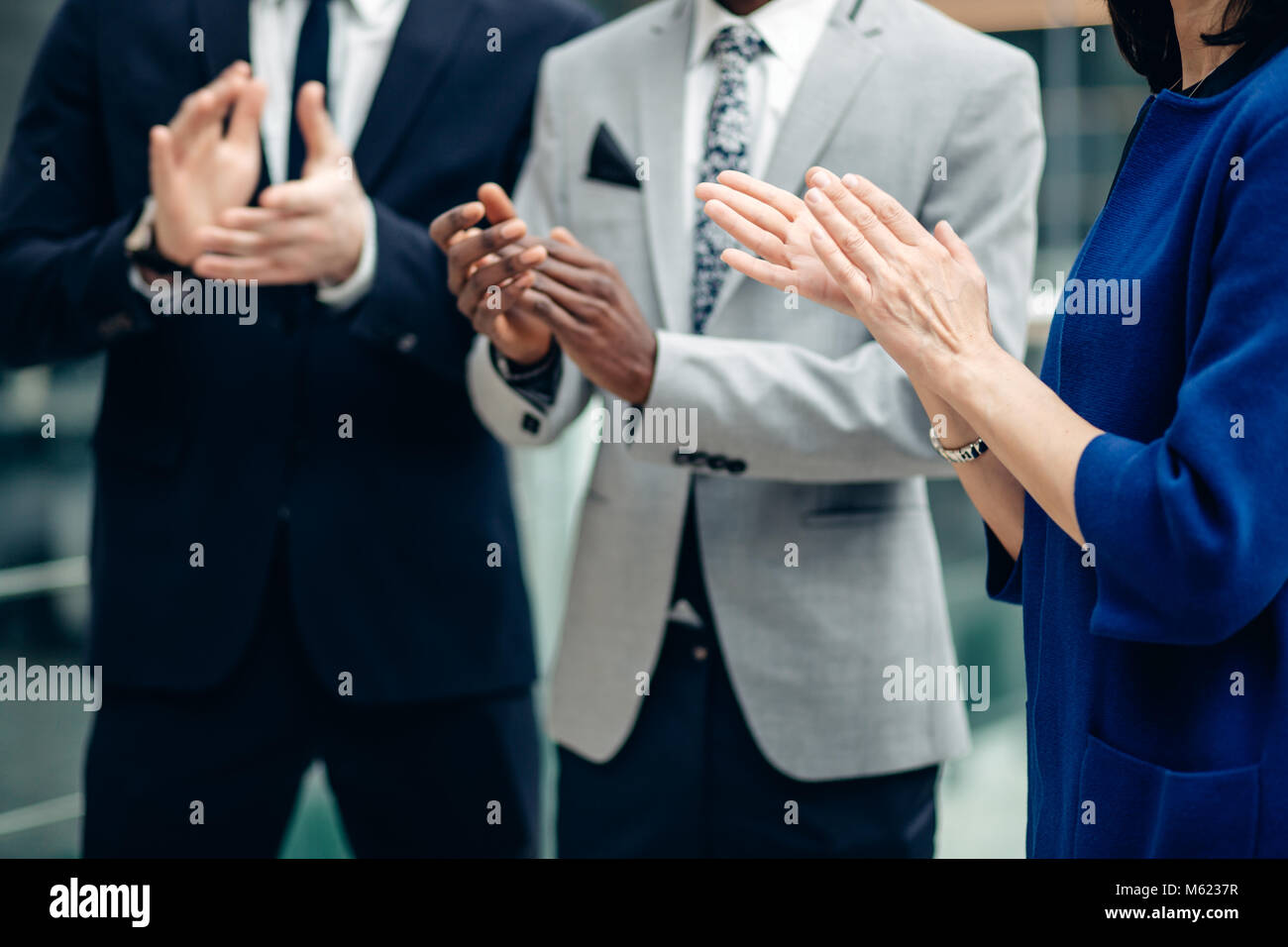 multiracial business team applauding themselves for great work done ...