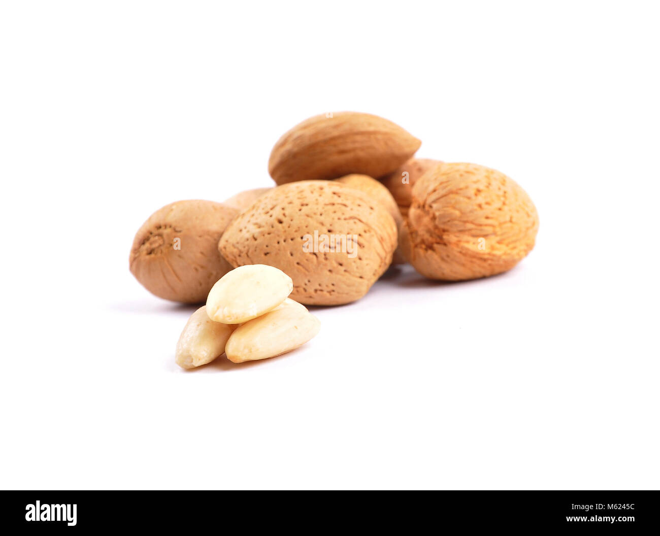 Almonds with and without shell on white Stock Photo - Alamy