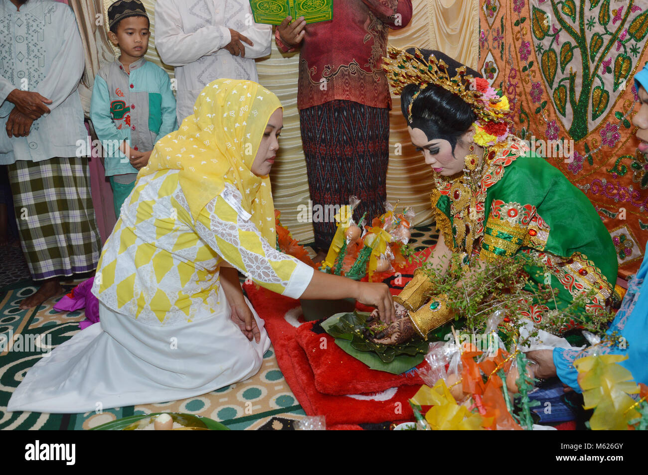 TARAKAN, INDONESIA - 9th January 2016 : "Mappacci" the traditional ...