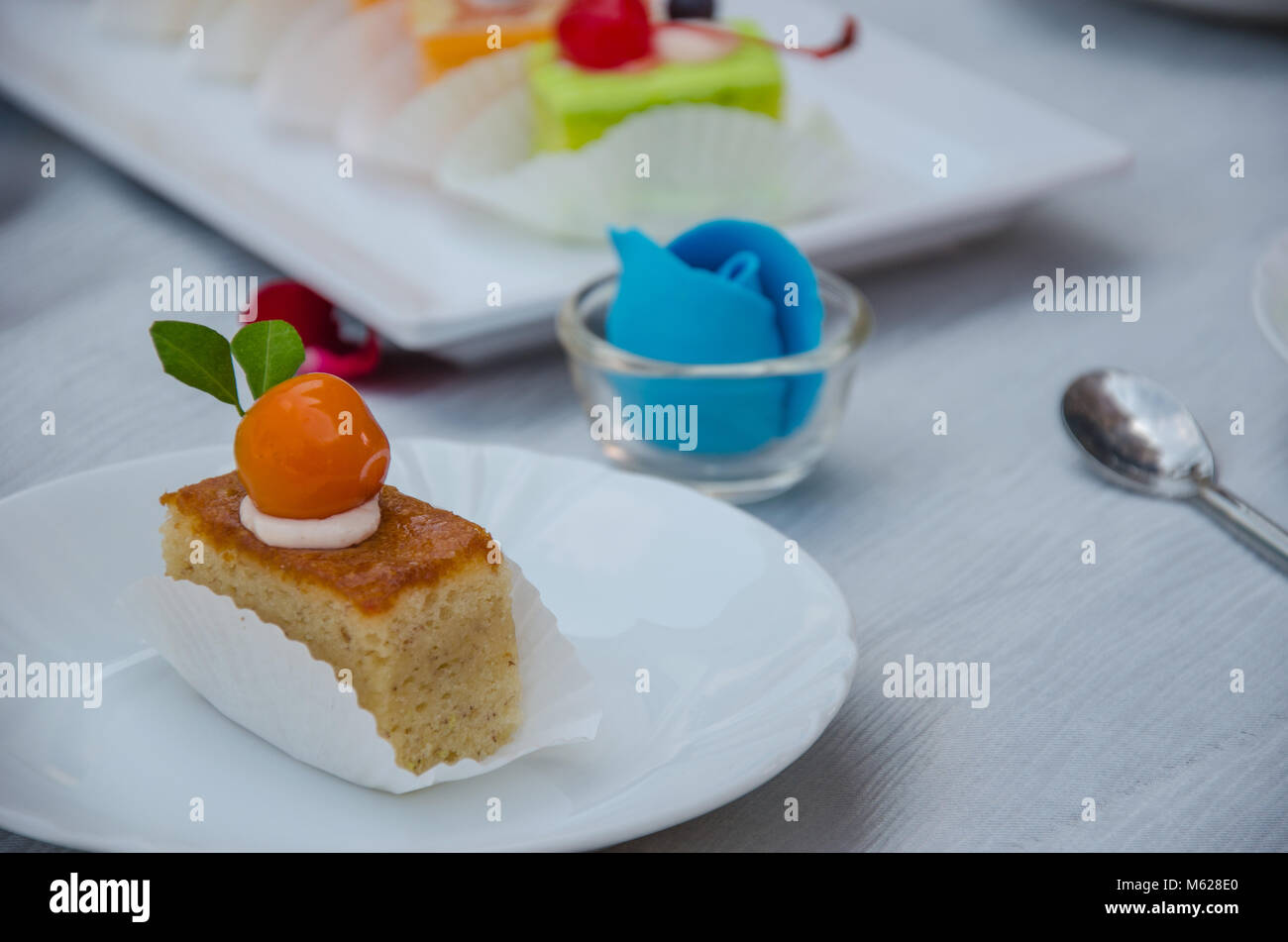 Cake cut into pieces on the table Stock Photo - Alamy