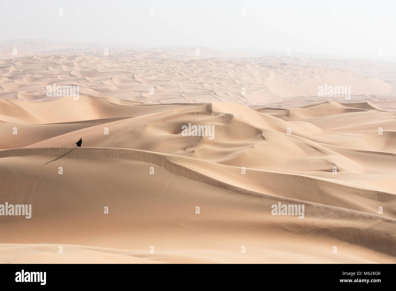 Young beautiful Caucasian woman posing in a traditional Emirati dress ...