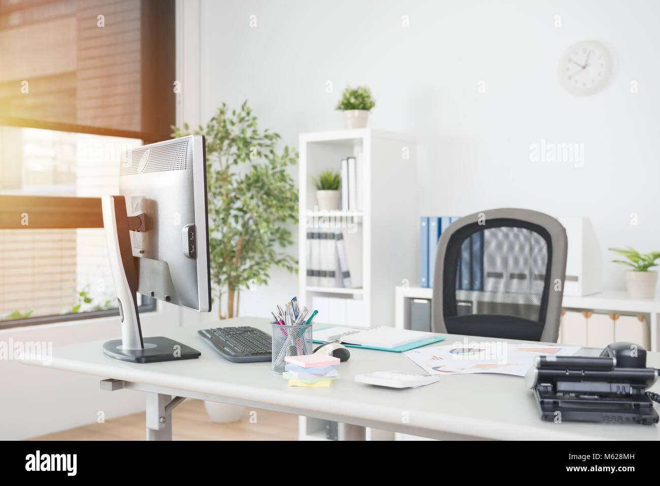 empty business workspace office room with nobody and warm sunlight ...