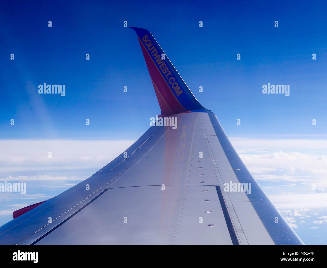 ORLANDO, FLORIDA - JUNE 2, 2017: Aerial photo of clouds with wing of ...
