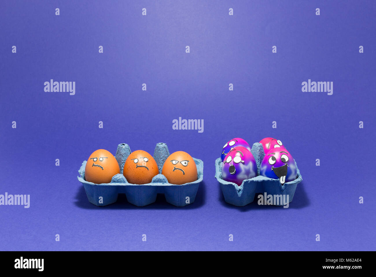 Group of colorful painted Easter eggs with funny cartoon style faces ...