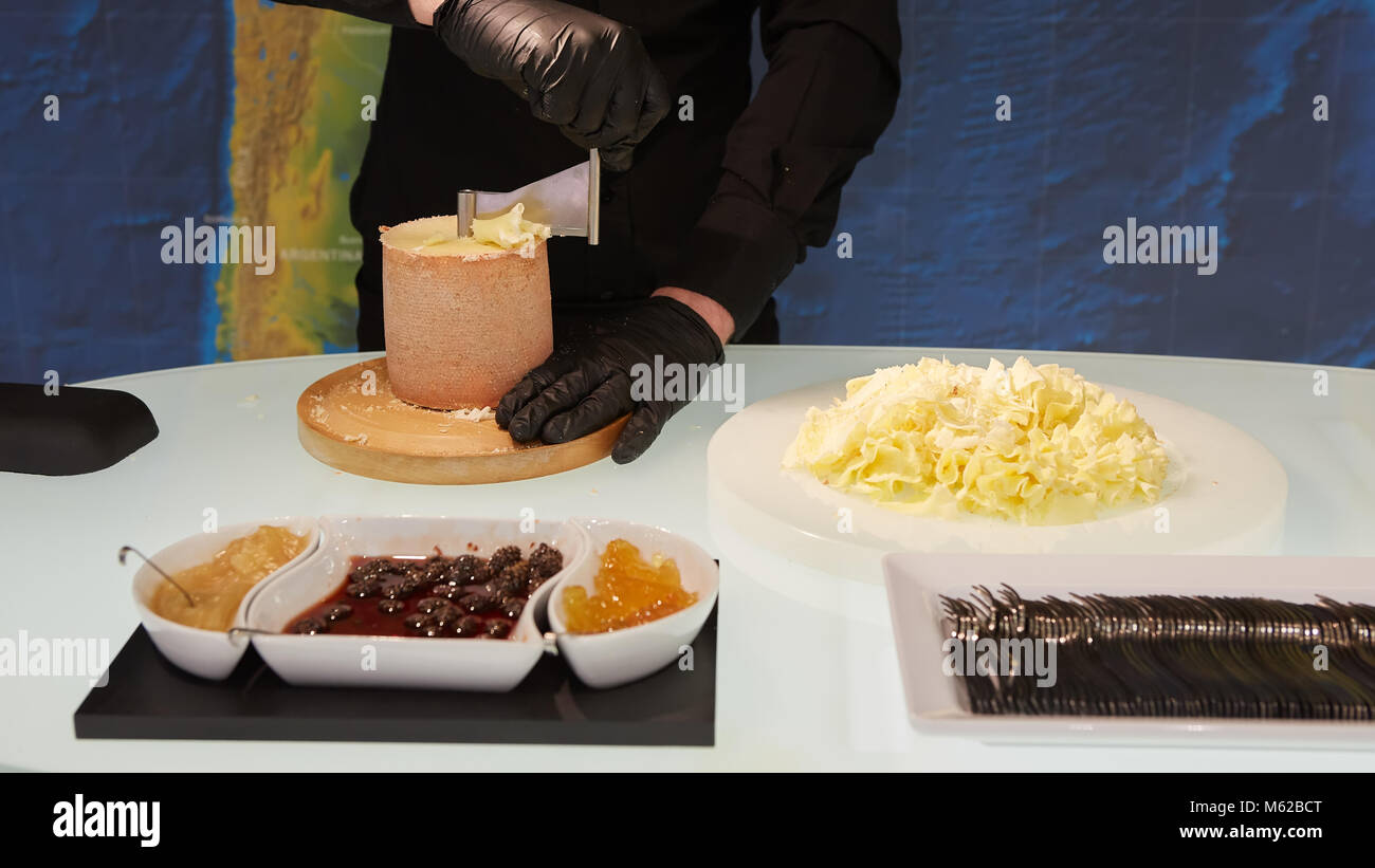Special cheese knives. The girolle scraper. Making cheese shaving on ...