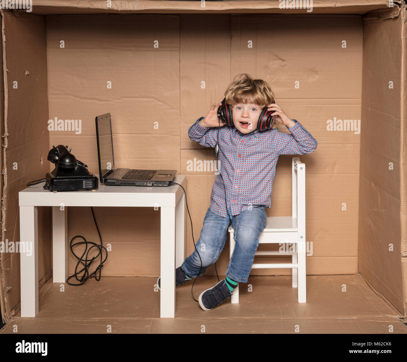 small businessman listens to music at work Stock Photo - Alamy