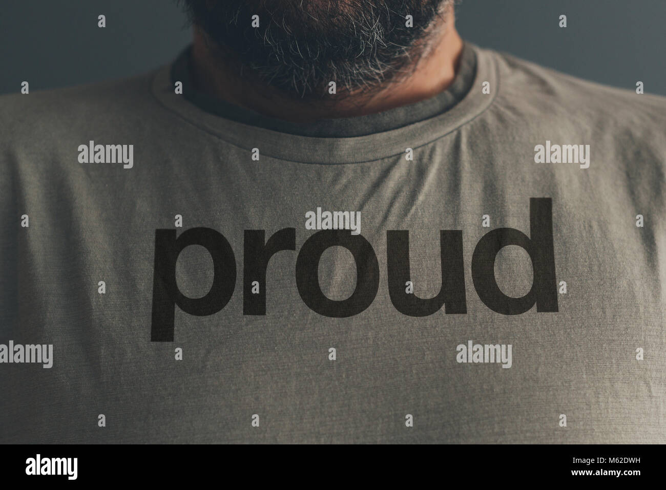 Adult caucasian male wearing t-shirt with title Proud Stock Photo - Alamy