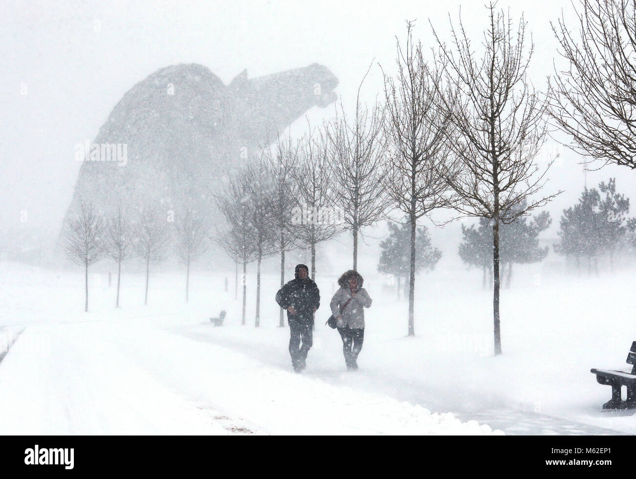 People walk through Helix Park near the Kelpies in Falkirk, as heavy ...