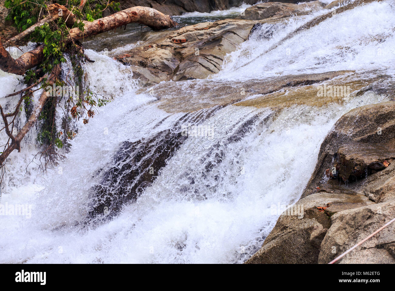 closeup cascade of small shallow foamy mountain river waterfalls in ...