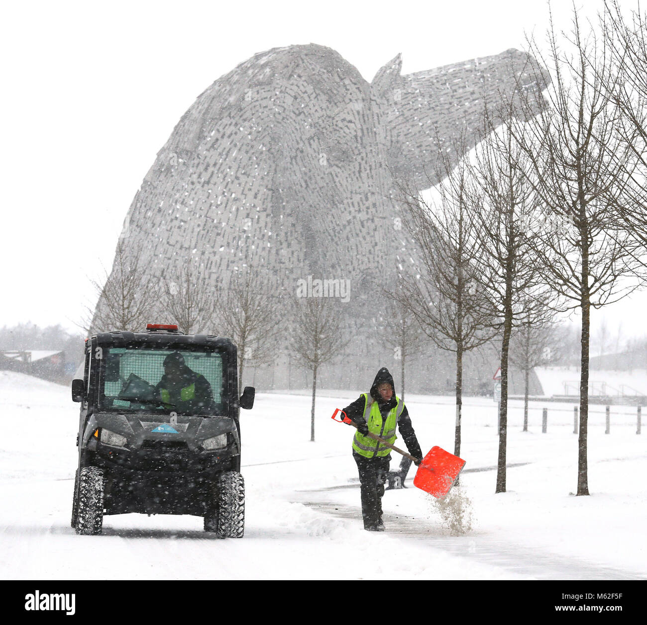 People grit the paths near the Kelpies in Helix Park, Falkirk, as heavy ...