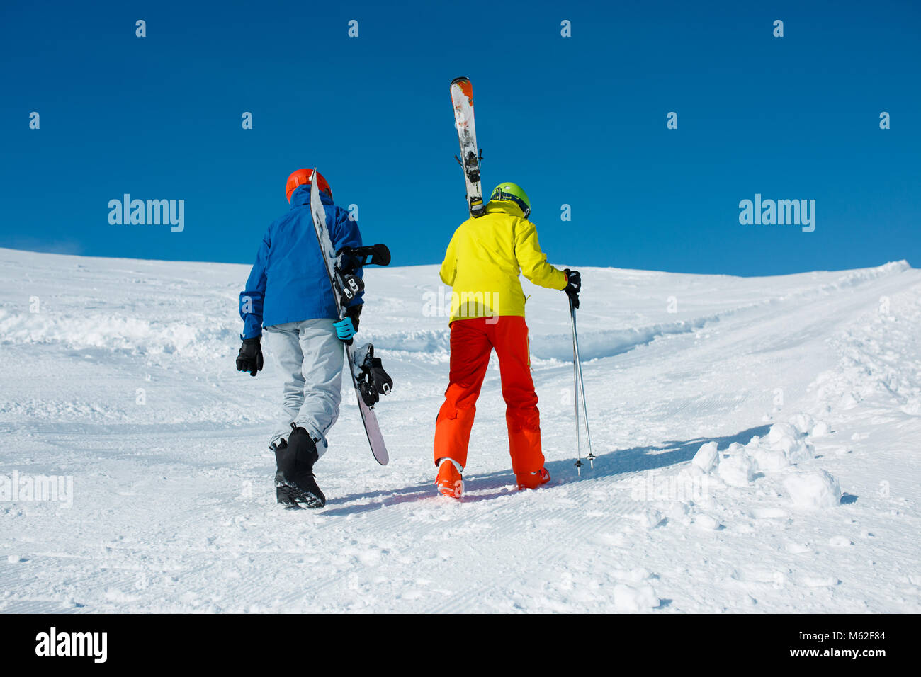 Photo of sports couple falling with snowboard Stock Photo - Alamy