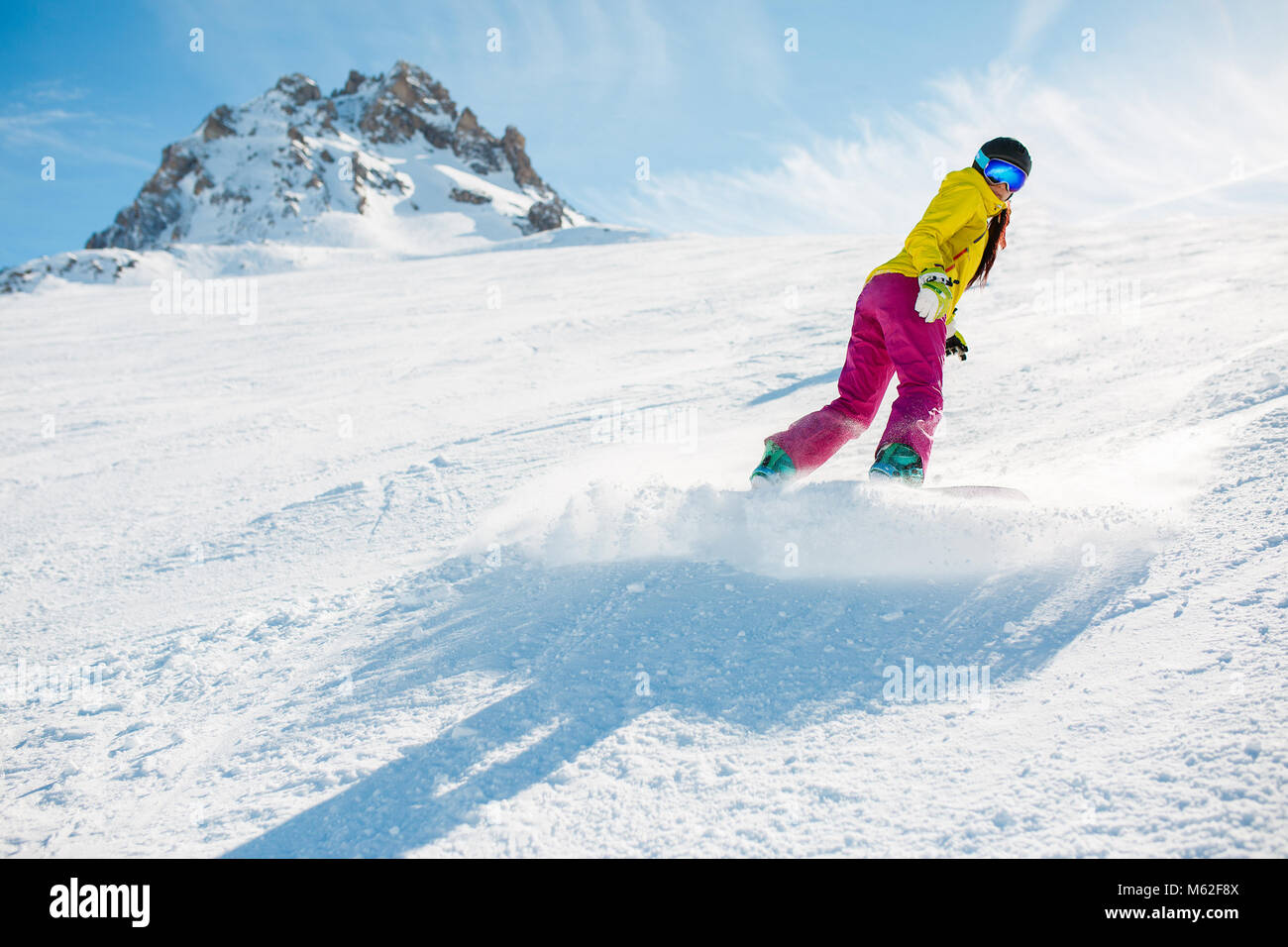 Picture of sports woman snowboarding on snowy slope Stock Photo - Alamy