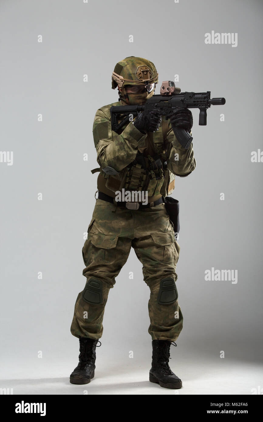 Photo of military man with gun Stock Photo - Alamy