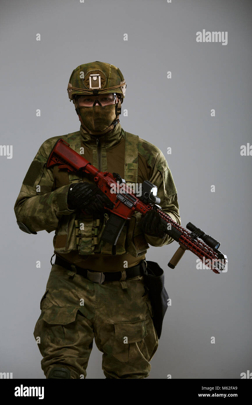 Picture of military man in helmet with gun Stock Photo - Alamy