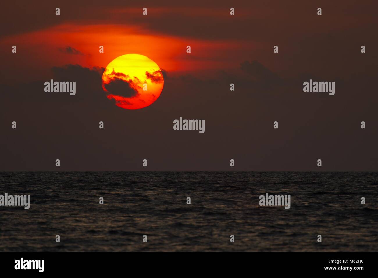 Classic sunset in Indian Ocean Stock Photo - Alamy