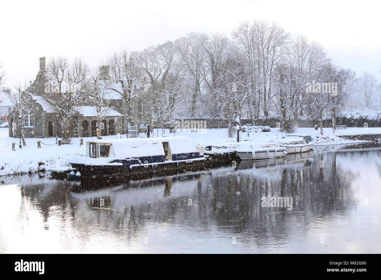 Barges in the river Barrow as snow falls in Athy, Co Kildare, as wintry ...