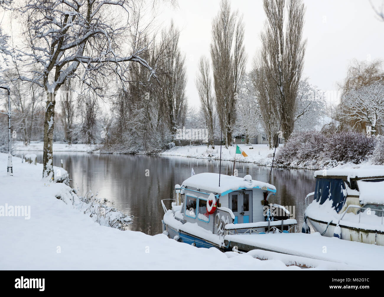 Boats on the river Barrow as snow falls in Athy, Co Kildare, as wintry ...