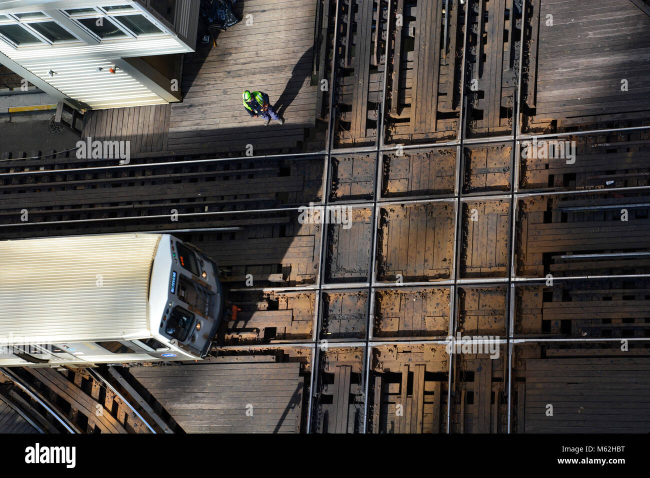 A CTA employee watches as a Green Line train enters the loop through ...
