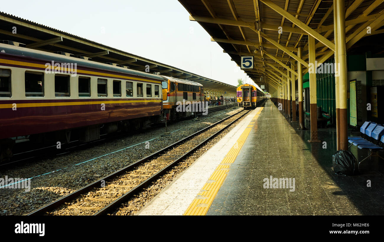 Old diesel train running for reconnect at a platform of railway station ...